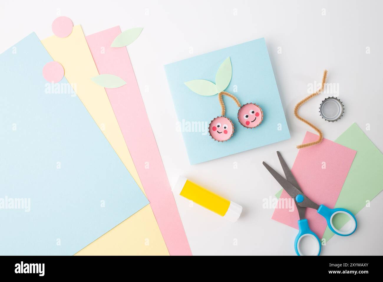 Scissors on paper in a child's craft project, showcasing cherry-themed ...