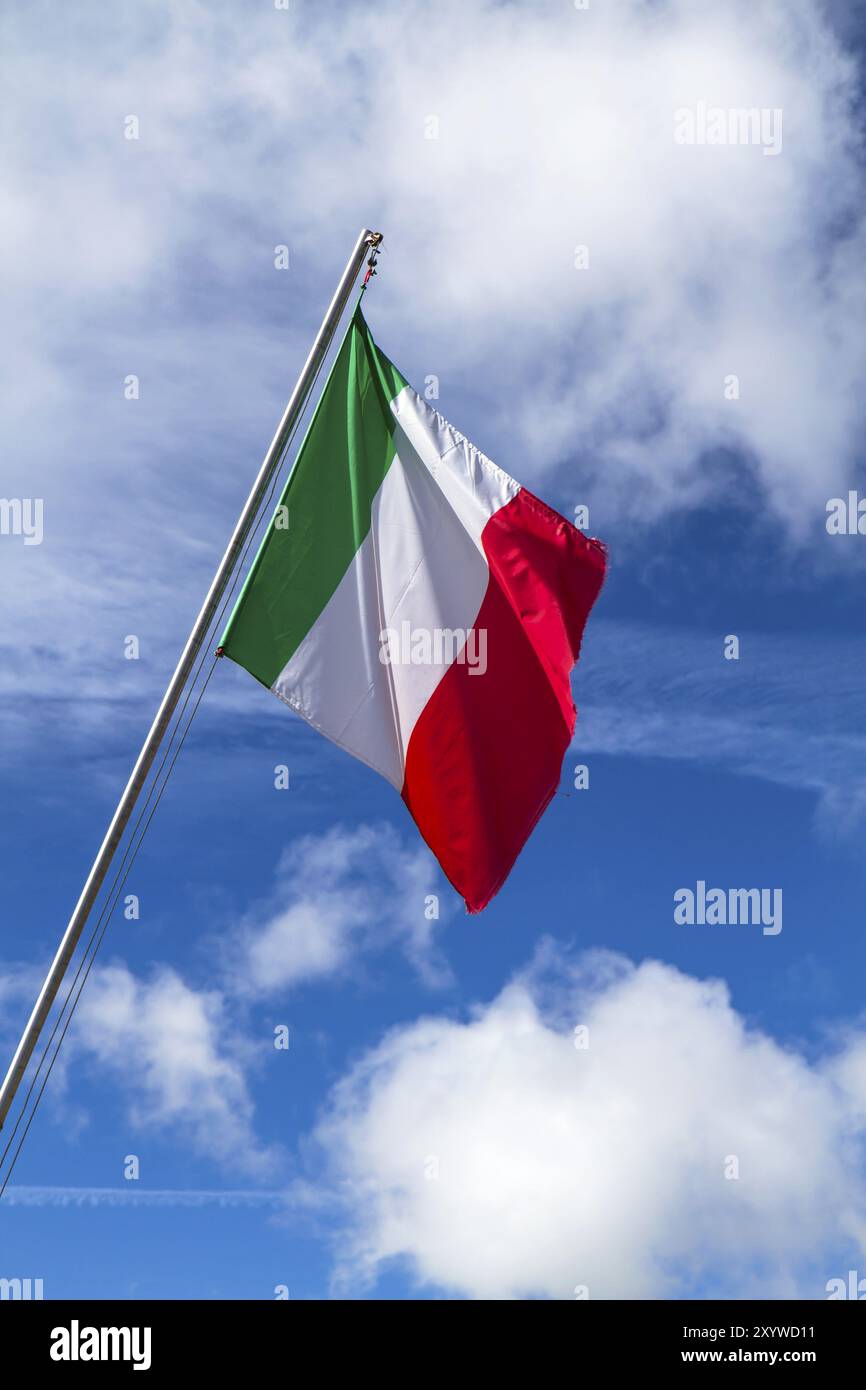 Italian flag in front of a blue sky Stock Photo - Alamy