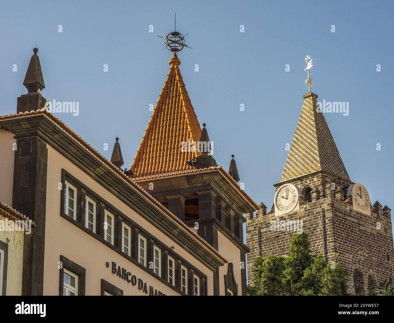 Church with two towers and a clock under a clear blue sky, Funchal ...