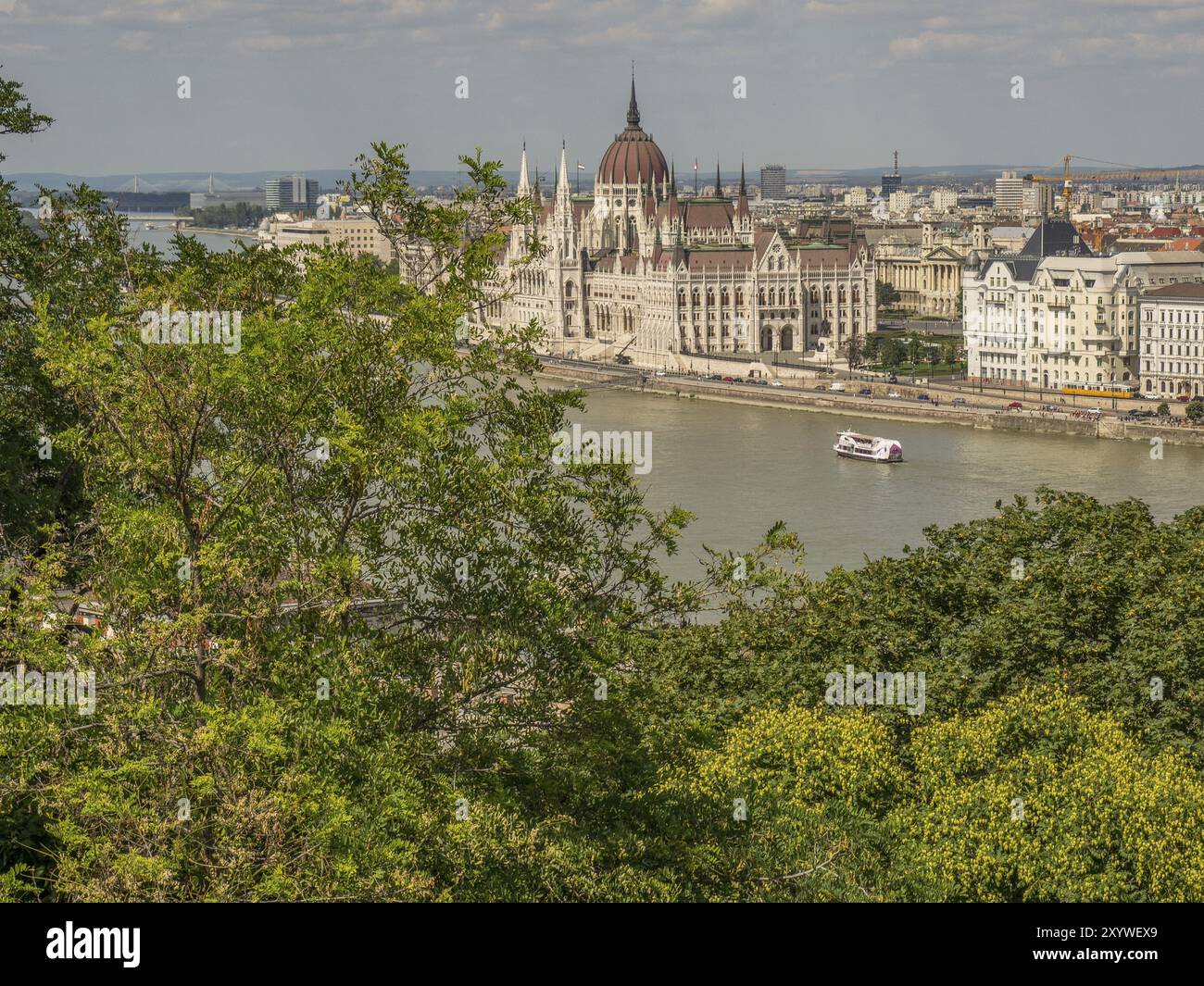 The parliament building, the river and surrounding greenery and trees ...