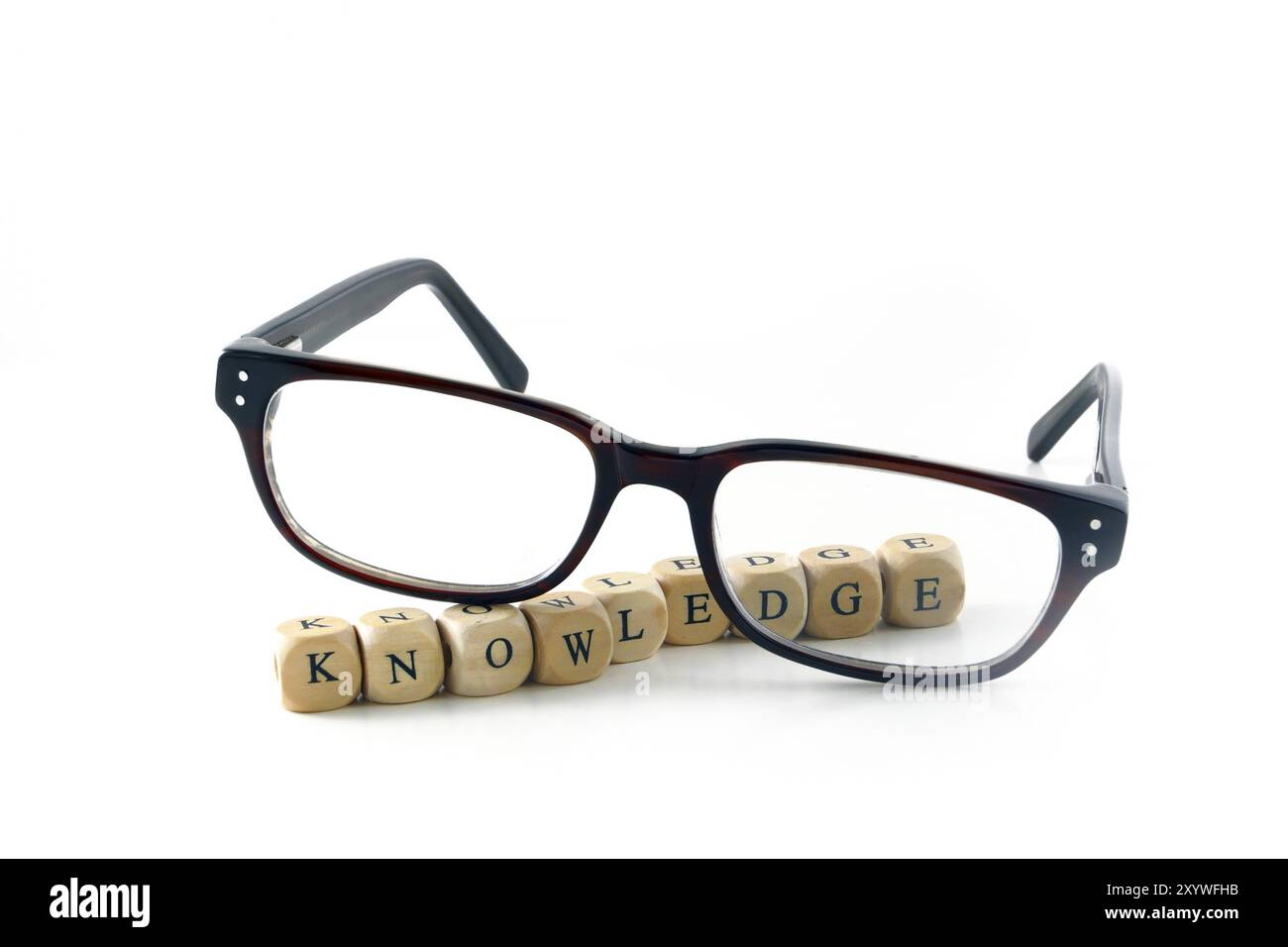 Glasses and knowledge message written in wooden blocks, symbol, concept ...
