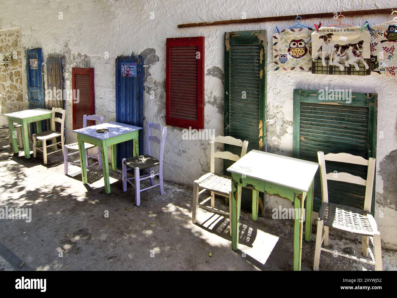 On a wall below one of the many cafes directly on the seafront, the ...
