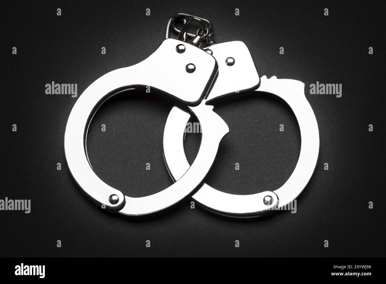 Crime law arrest police steel handcuffs isolated Stock Photo - Alamy