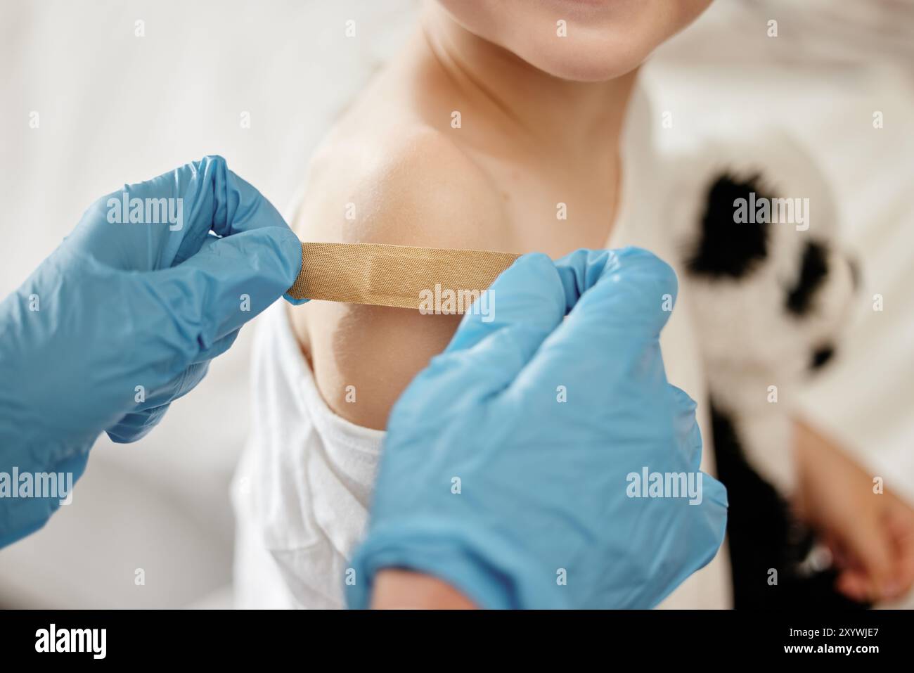 Hands, doctor and child with bandage for injection, healthcare and help ...
