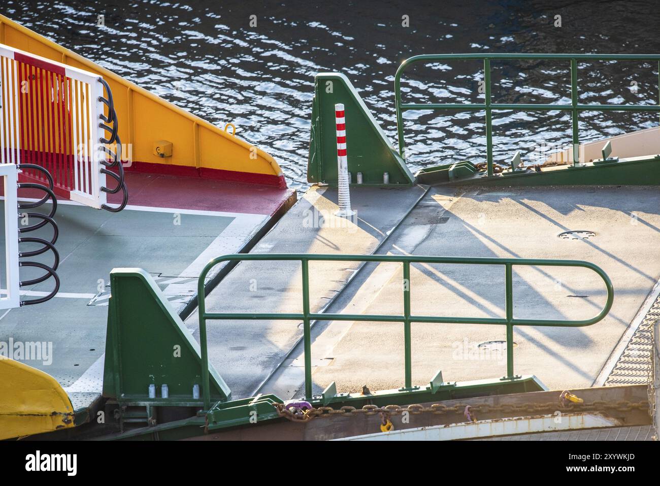 Ramp of a yellow car ferry lowered and ready for loading cars Stock ...