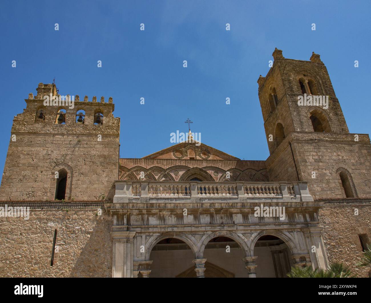 Imposing cathedral with high towers and ancient walls under a clear ...