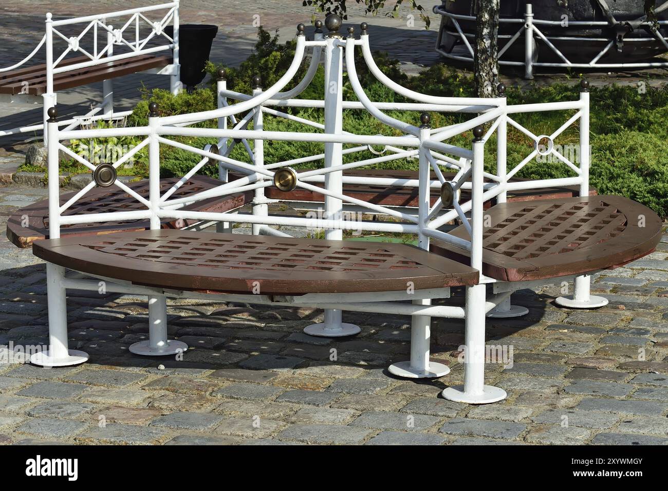 Modern white round metal Park bench closeup Stock Photo - Alamy