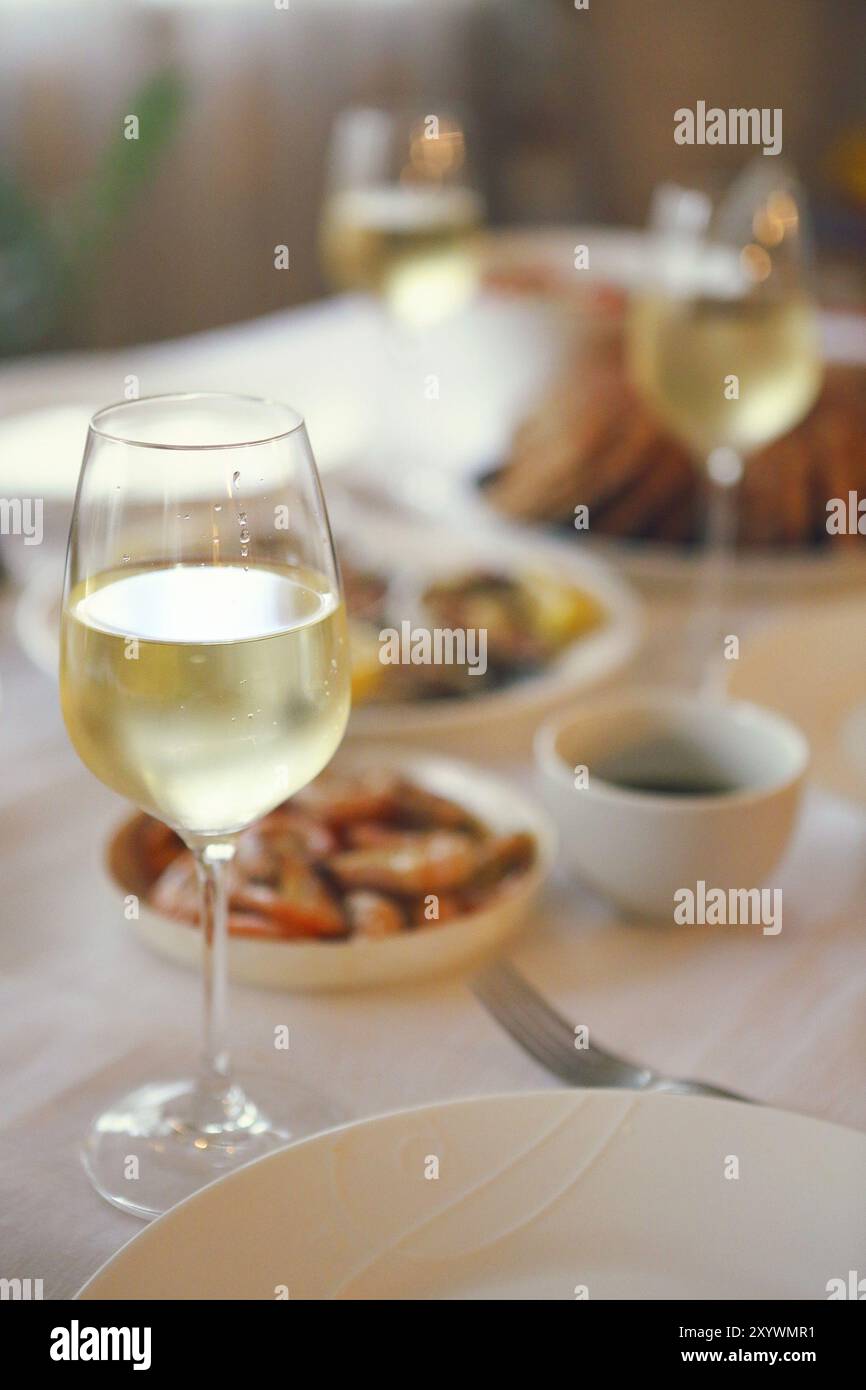 People fine dining seafood and white wine on the table Stock Photo - Alamy