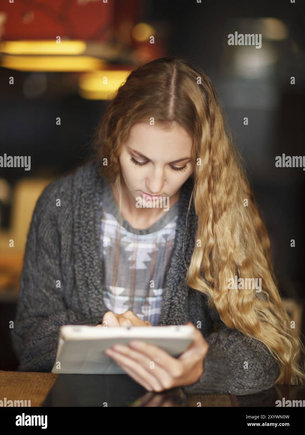 Woman taps tablet screen hi-res stock photography and images - Alamy