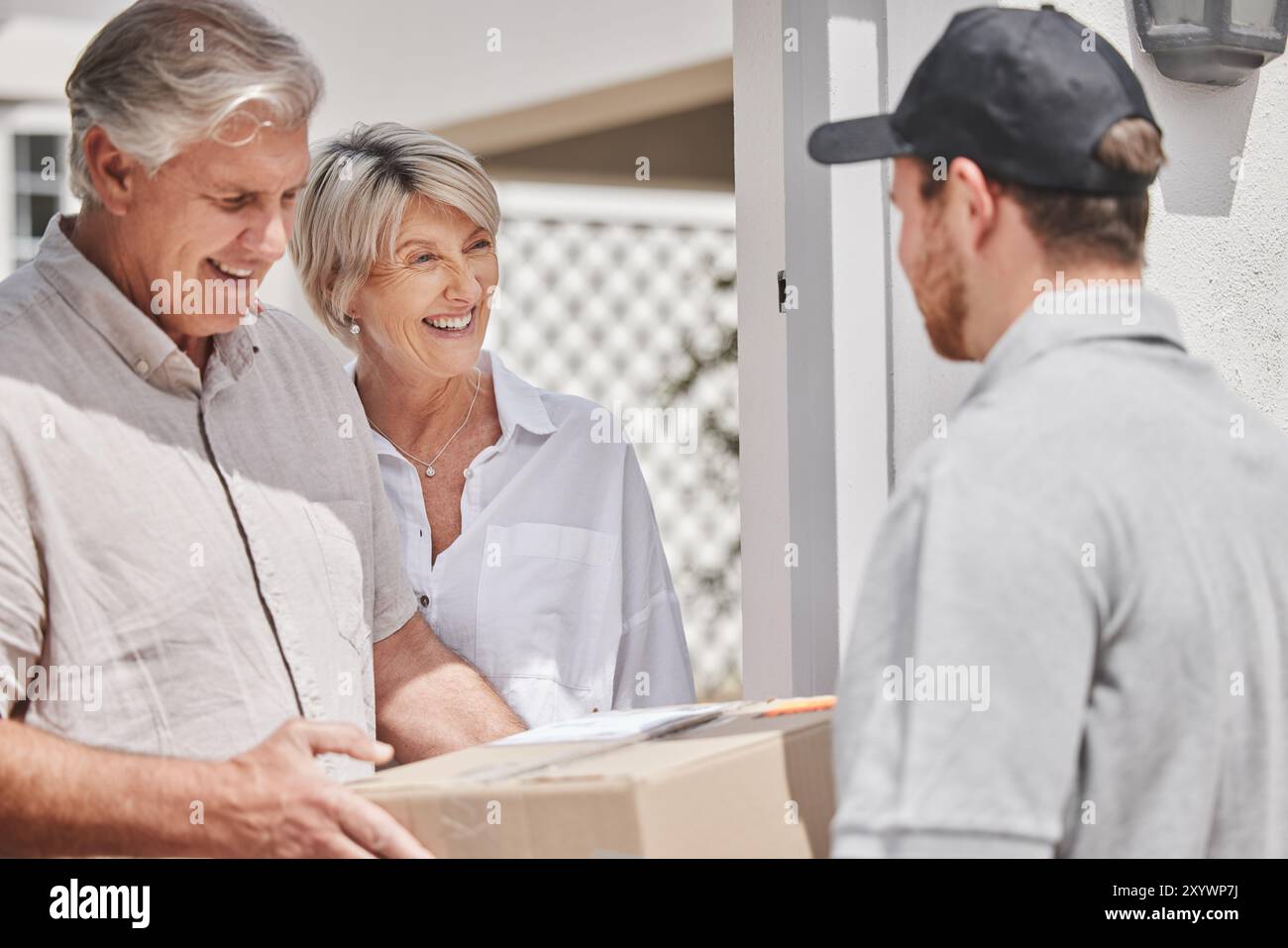 Front door, package and senior couple with deliveryman for ecommerce ...