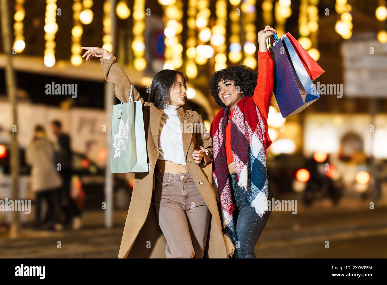 Two friends laughing night city hi-res stock photography and images - Alamy