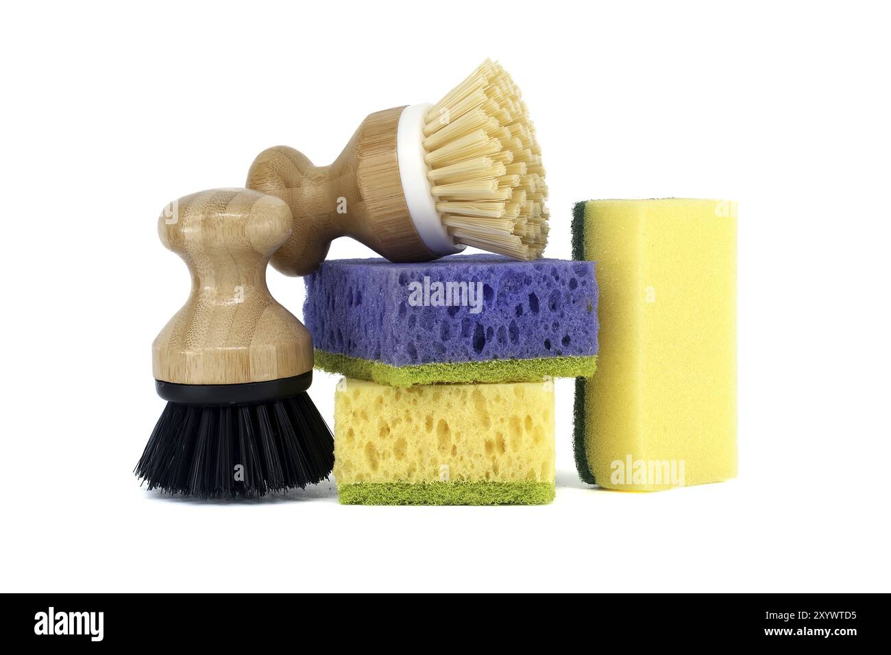 Three sponges, each a different color purple, yellow, and blue and two ...