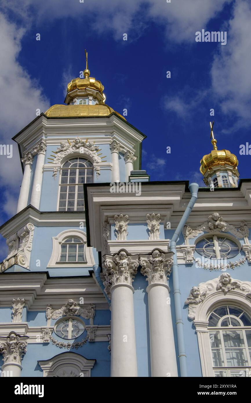 Impressive tower of a baroque church, richly decorated with gold and ...
