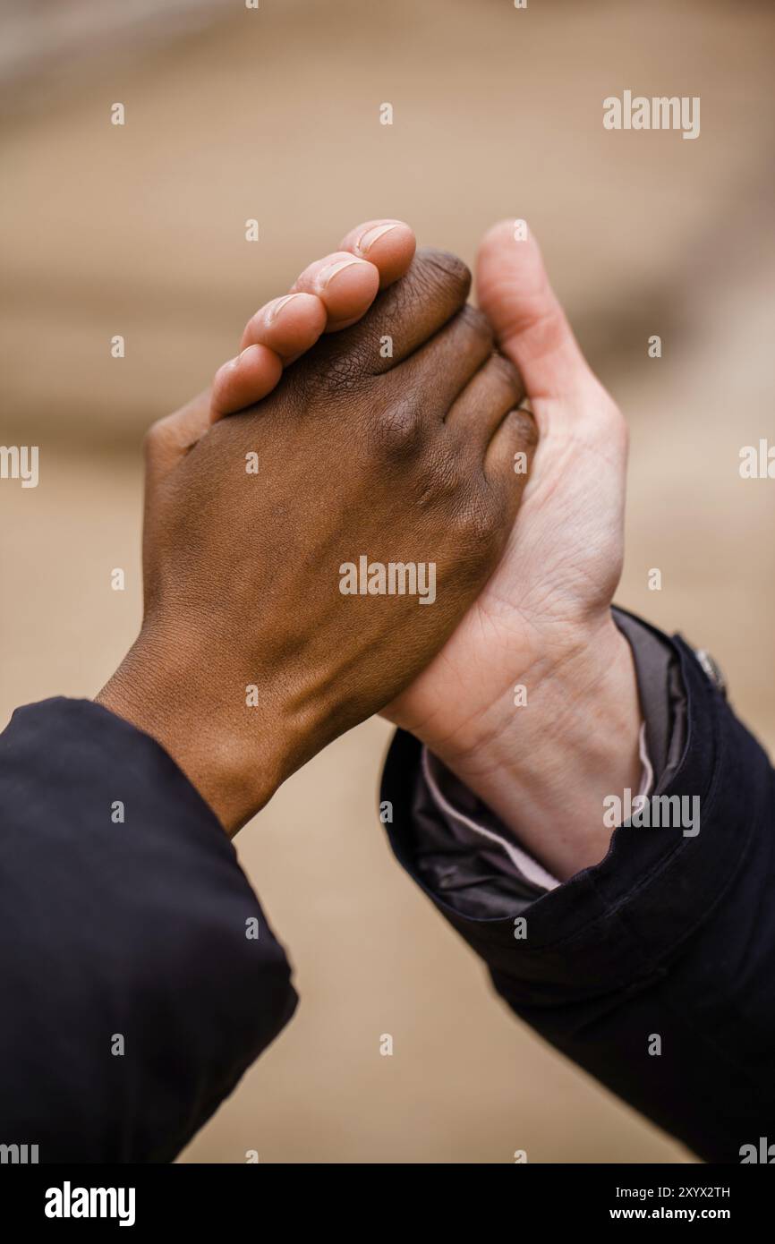 Two friends high-fiving each other Stock Photo - Alamy