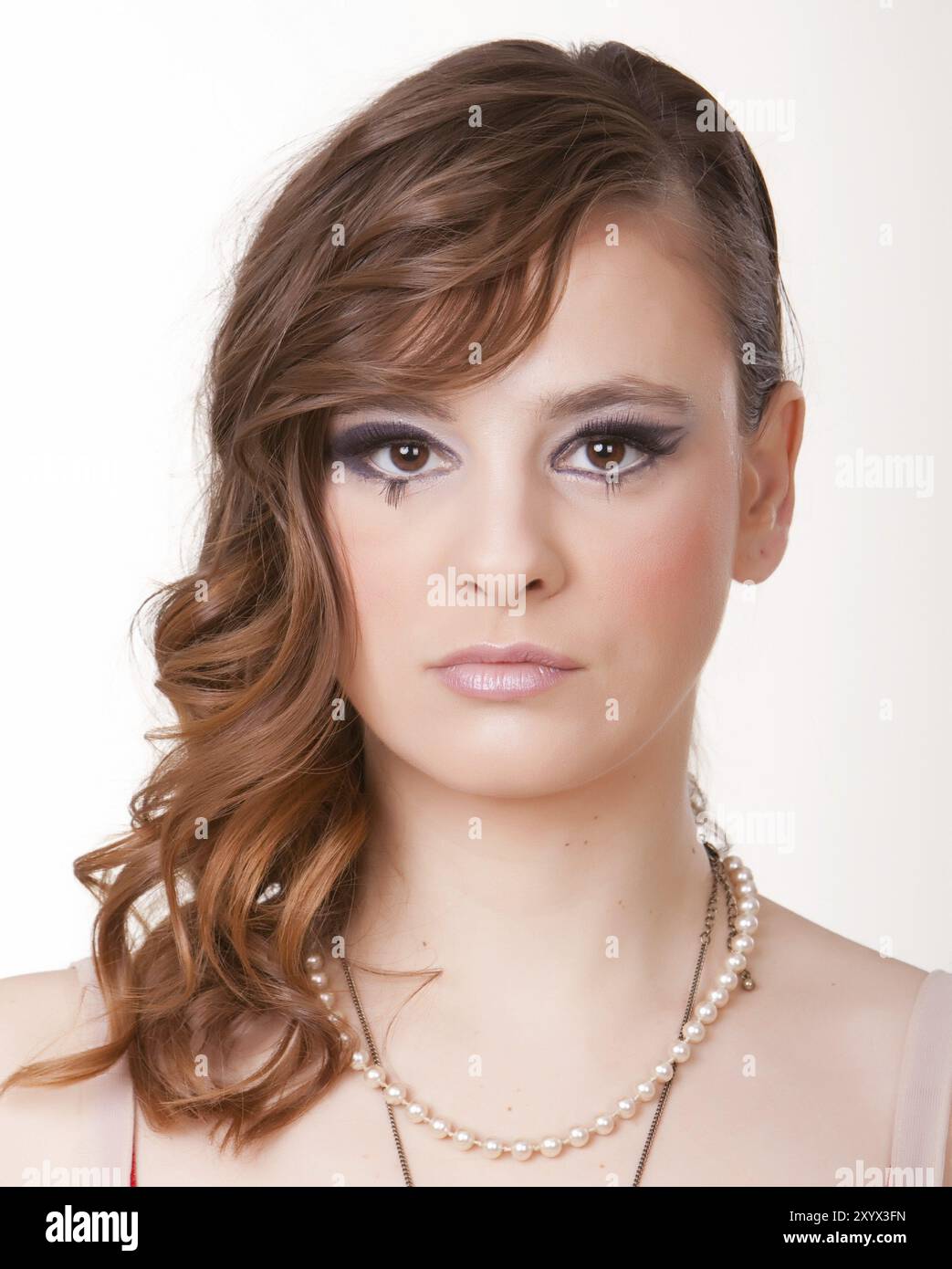 Portrait of a beautiful young woman with long brown hair Stock Photo ...