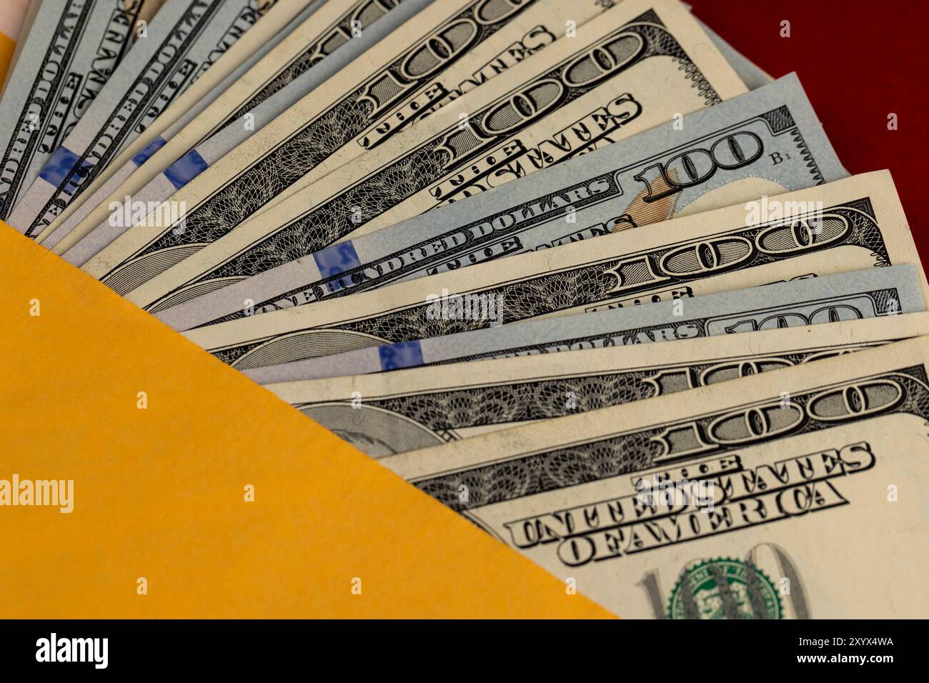 new yellow paper envelopes with American dollars, folded American 100 ...