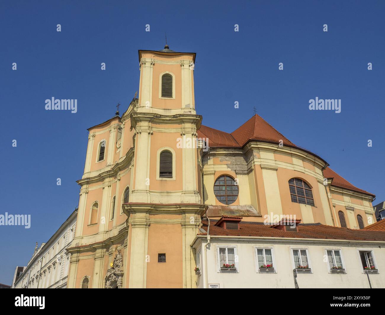 Baroque church with towers, red roof and windows under a clear sky in ...