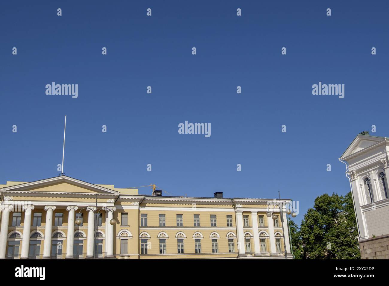Historic buildings with classical facades and columns under a clear ...