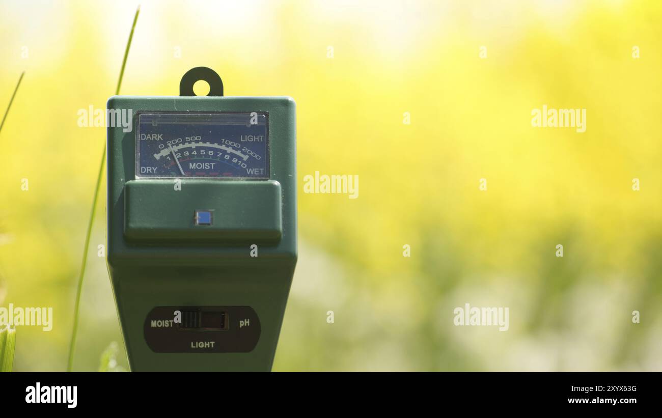 Soil moisture, light intensity and PH testing meter in close up ...