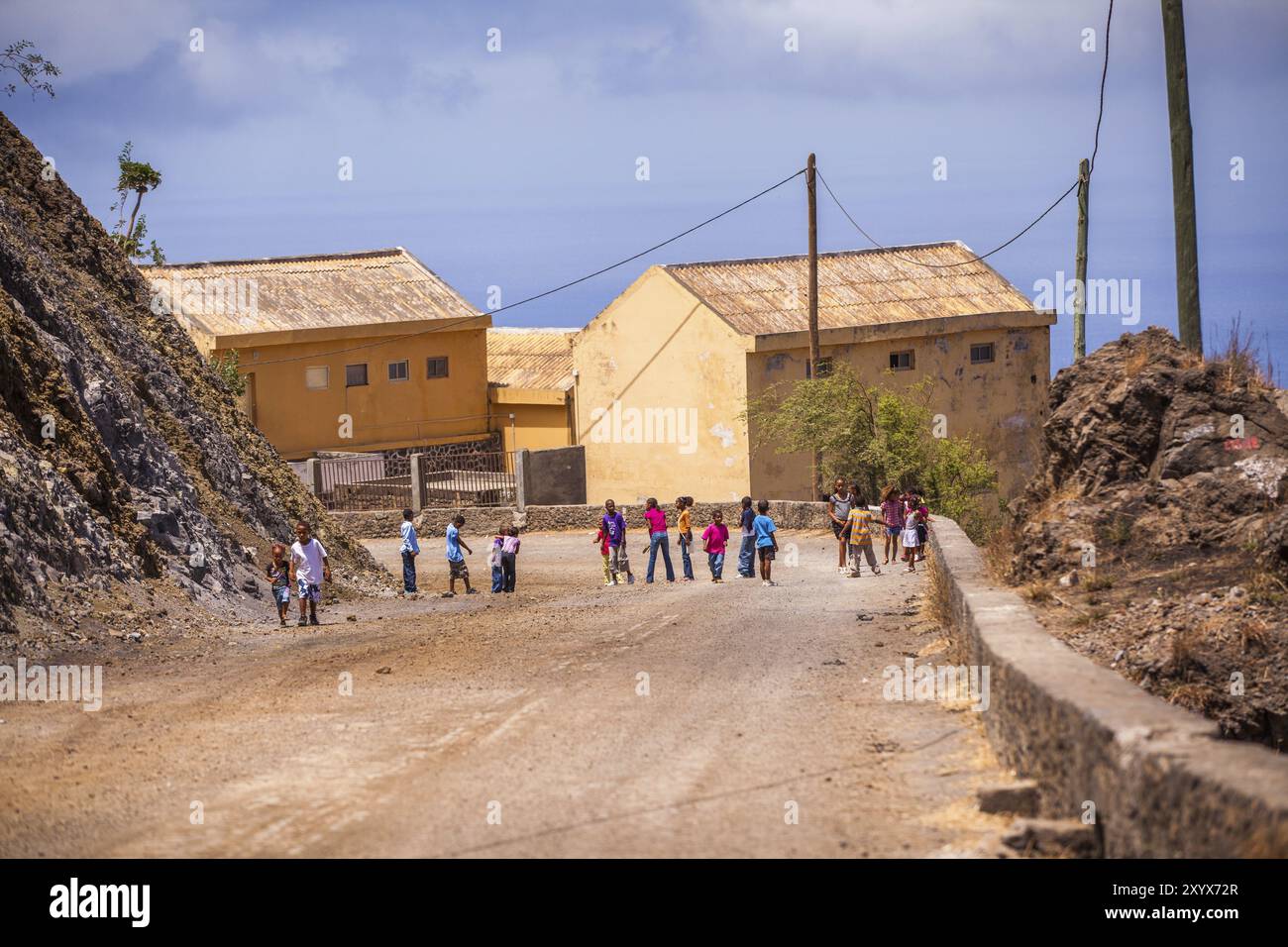 Children play on a dusty street in a small village Stock Photo - Alamy