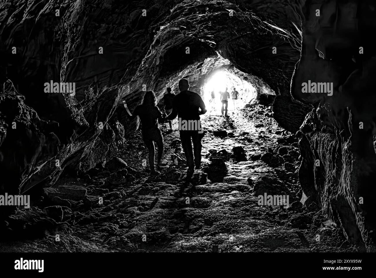 Emerging from Darkness: A Journey from Cave to Light Stock Photo - Alamy