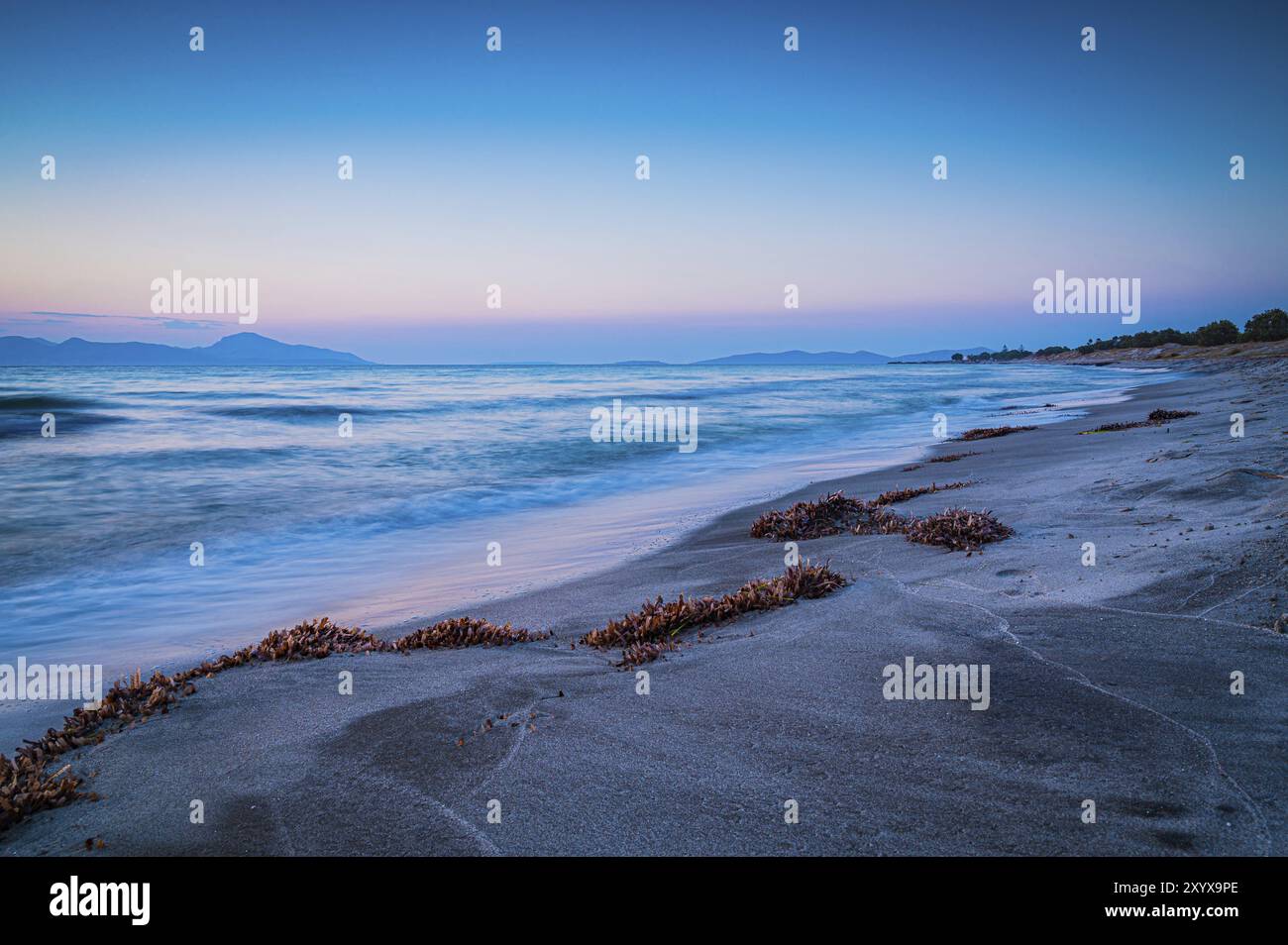 Serene empty beach gentle waves hi-res stock photography and images - Alamy