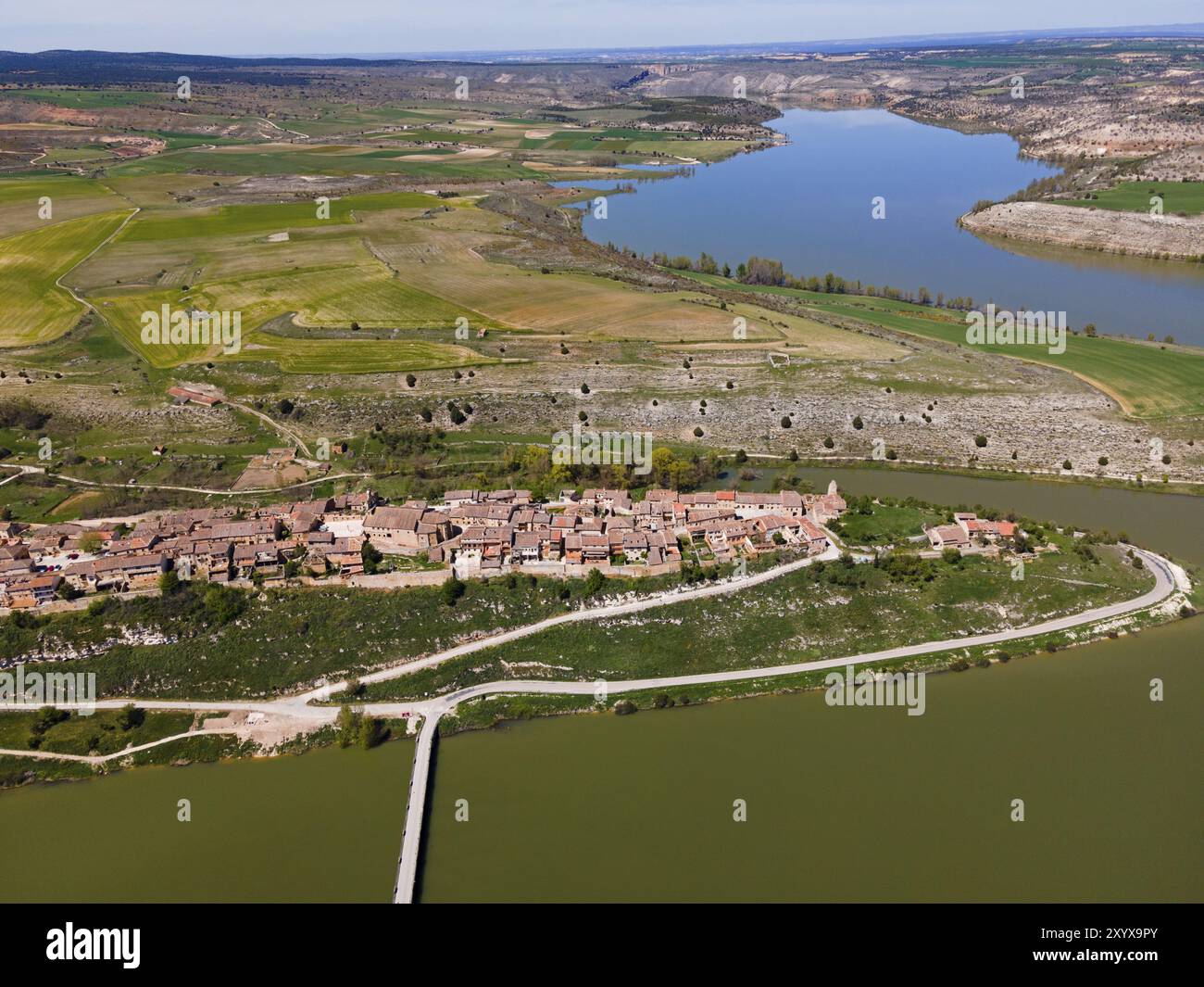 Aerial view of a river meandering through a green landscape with a ...