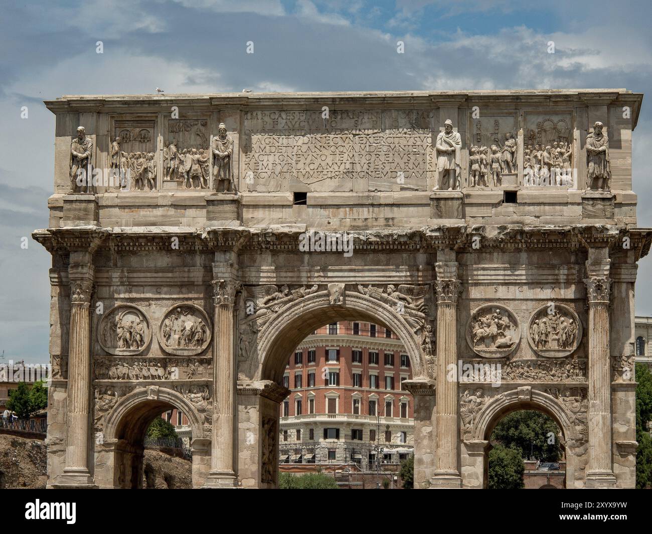 Frontal close-up of the Arch of Constantine with ornate reliefs and ...