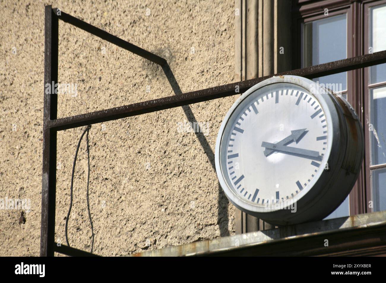 Rotten clock on a dilapidated school building Stock Photo - Alamy