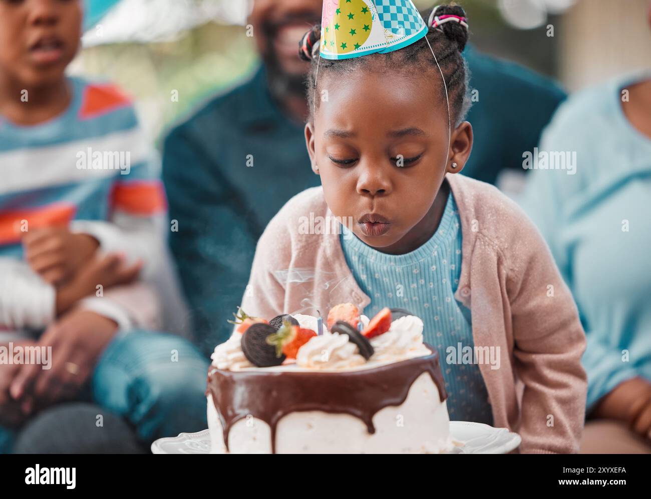 Birthday cake, home and black kid blowing candles for wishes, good luck ...