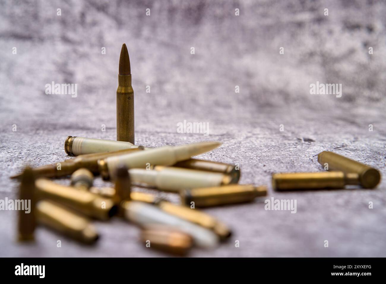 Composition of rounds of ammunition on floor Stock Photo - Alamy