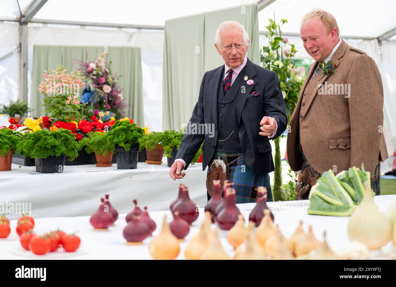 King Charles III with chairman Brian Grant during a visit to the Royal ...