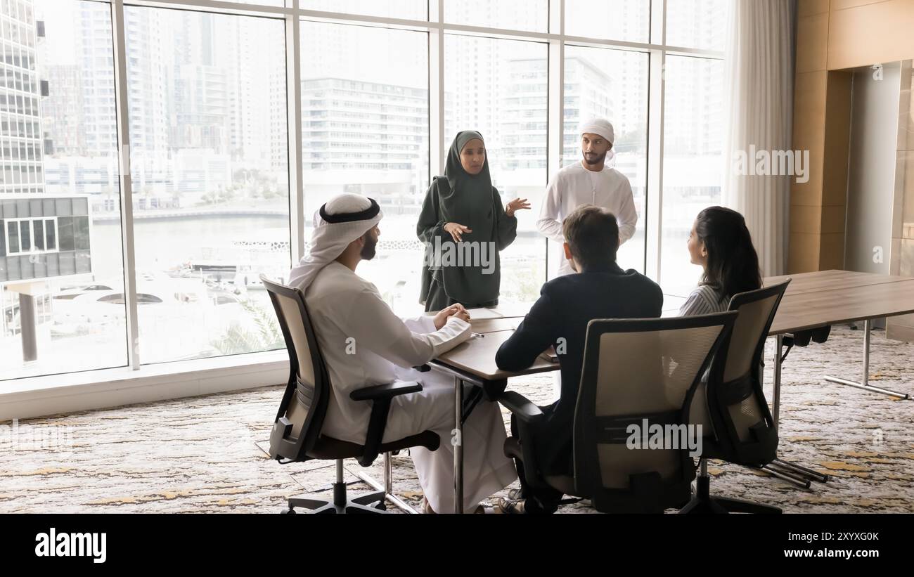 Arabian female manager in hijab presenting business project strategy ...