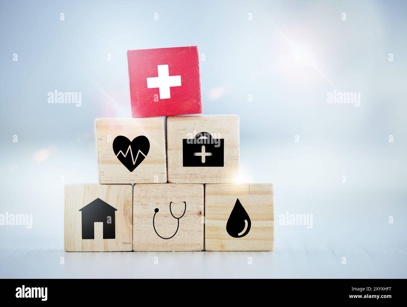 Healthcare, insurance and medicine with building blocks on desk in ...