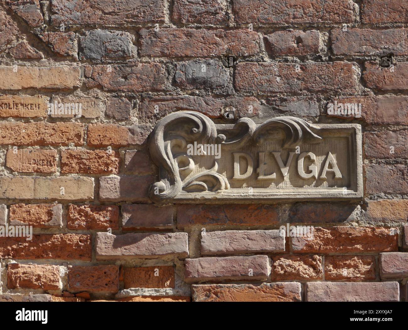 Long brick wall with sign hi-res stock photography and images - Alamy