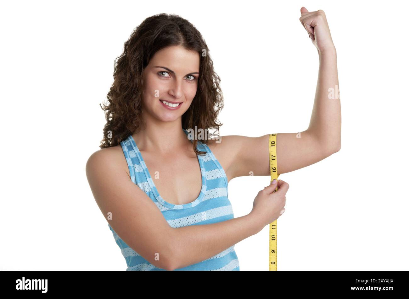 Surprised woman measuring her Biceps, isolated in a white background ...