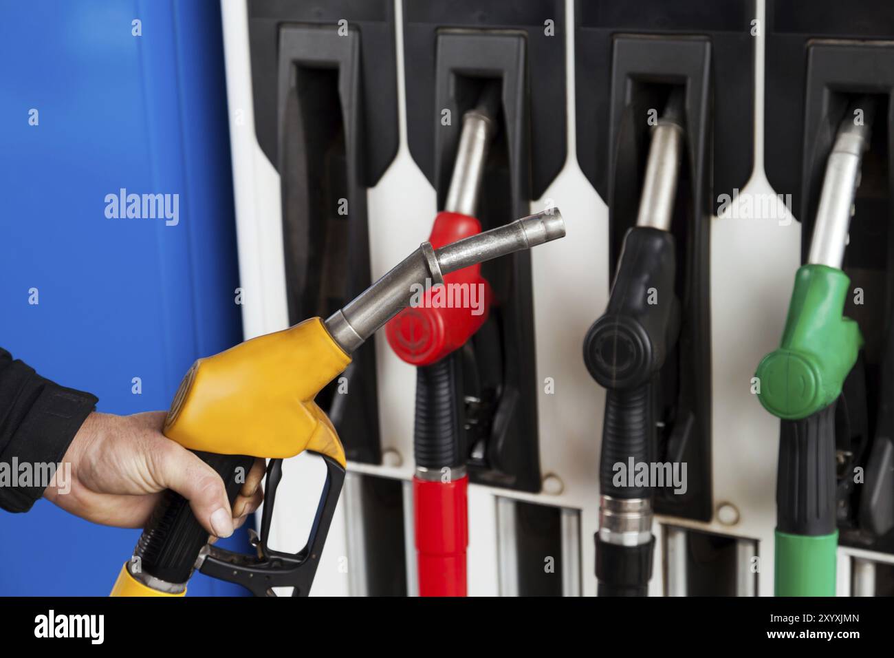 Human hand holding gasoline station gas fuel pump Stock Photo - Alamy