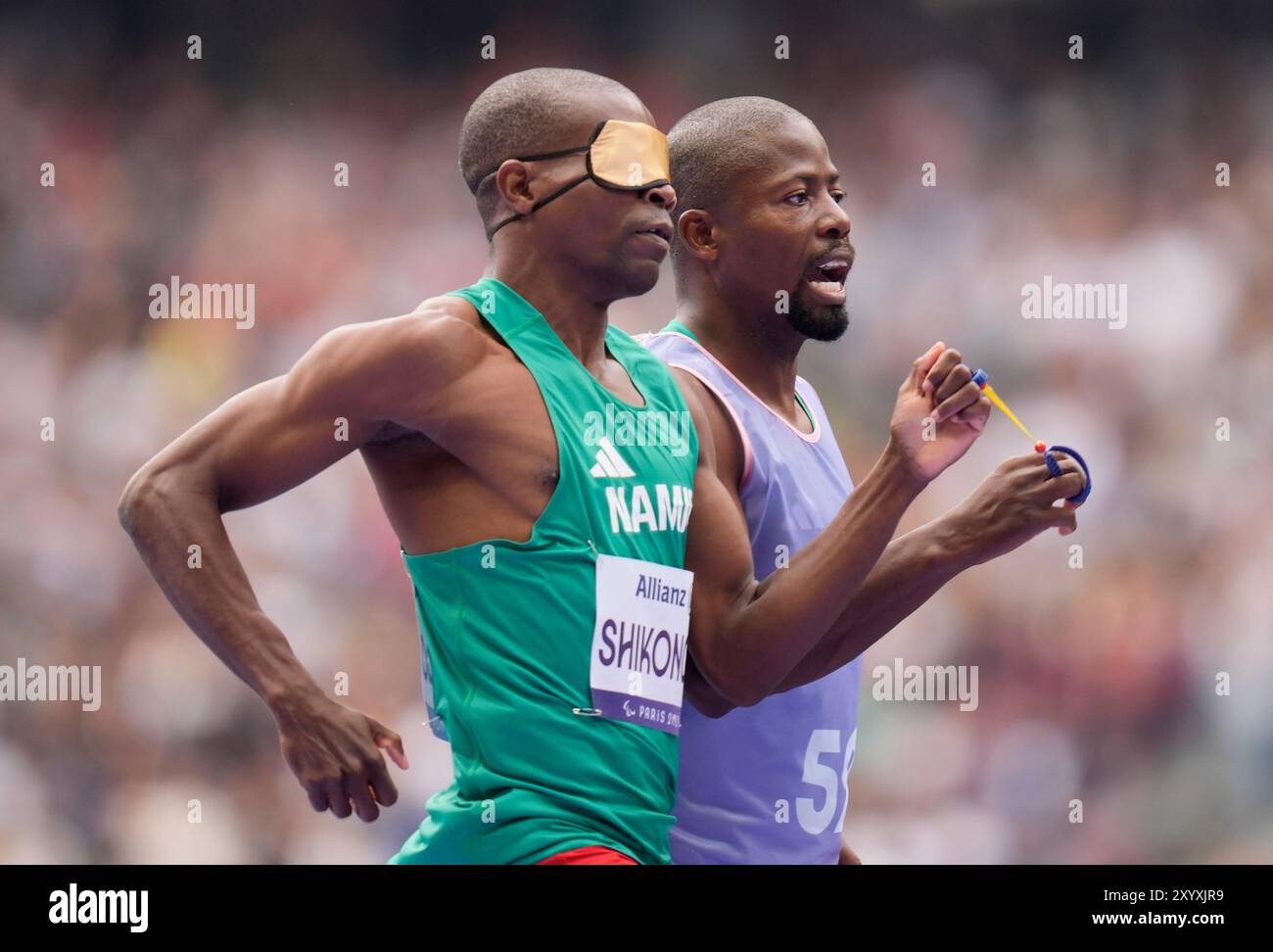 Namibia's Ananias Shikongo (left) and his guide Even Tjiuiju compete in ...