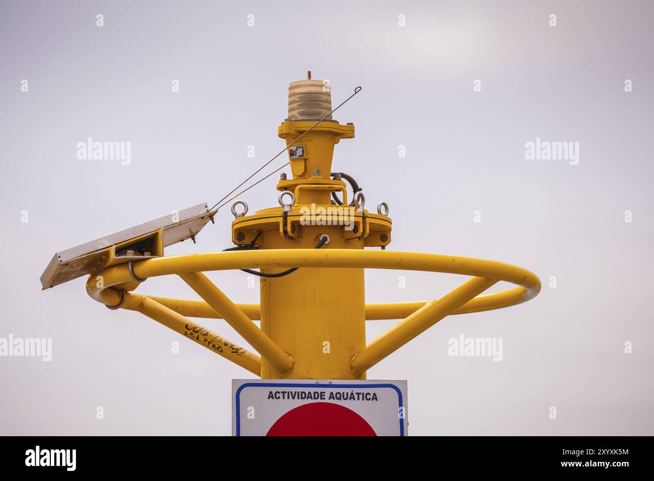 Yellow mast with traffic sign Stock Photo - Alamy