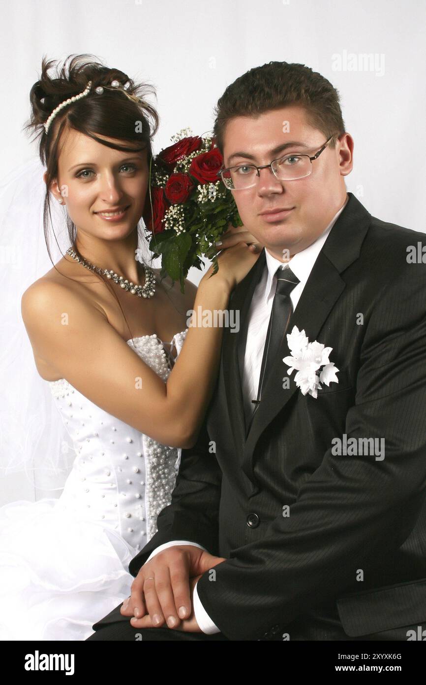 Newly married together in a photo pose Stock Photo - Alamy