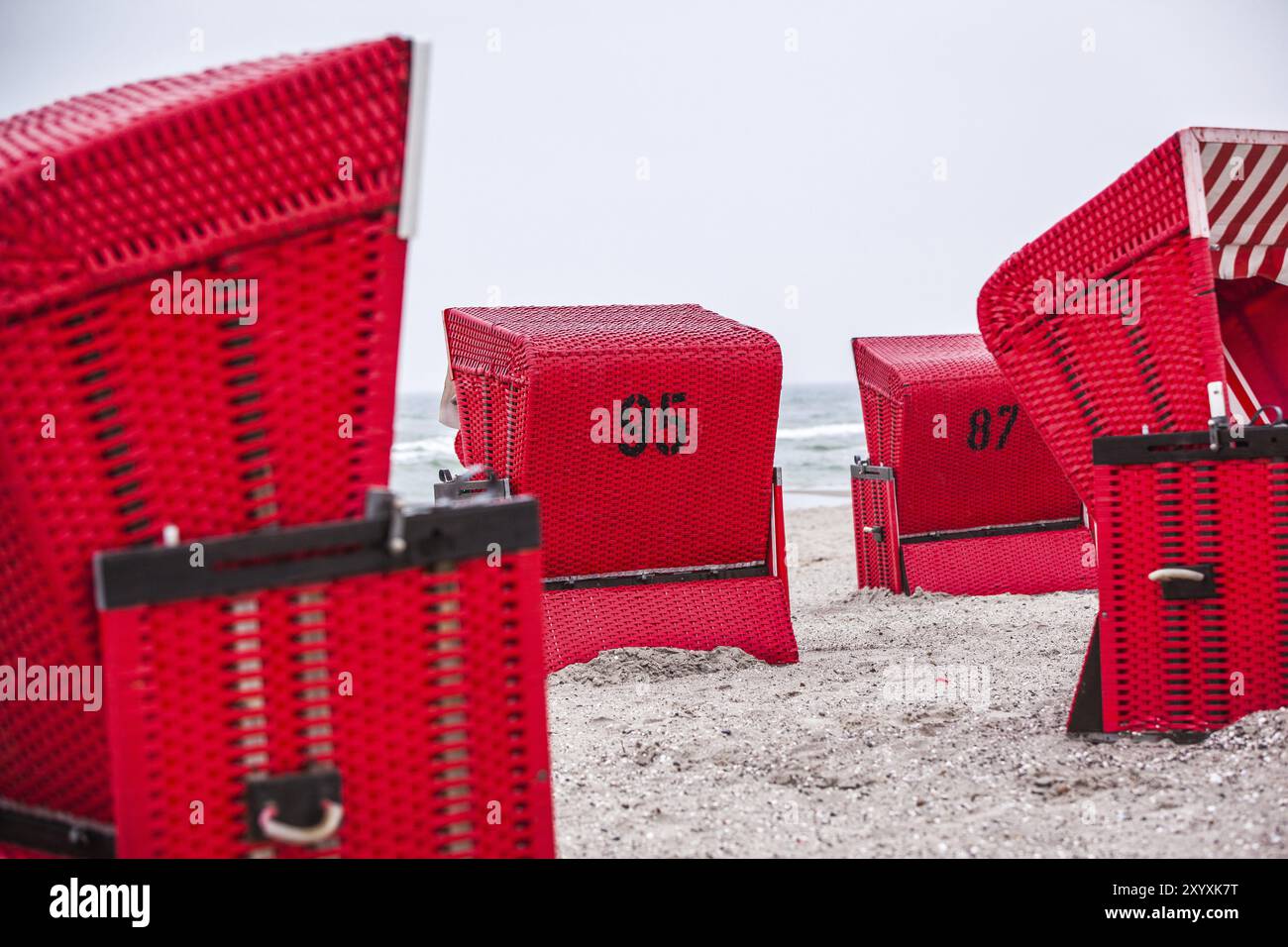 Red beach chairs on the beach Stock Photo - Alamy