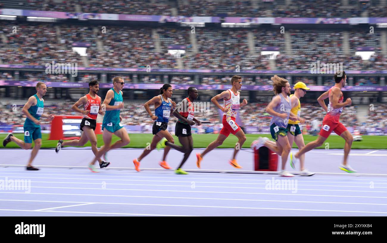 Athletes compete in the Men's 5000m T13 final at the Stade de France on ...