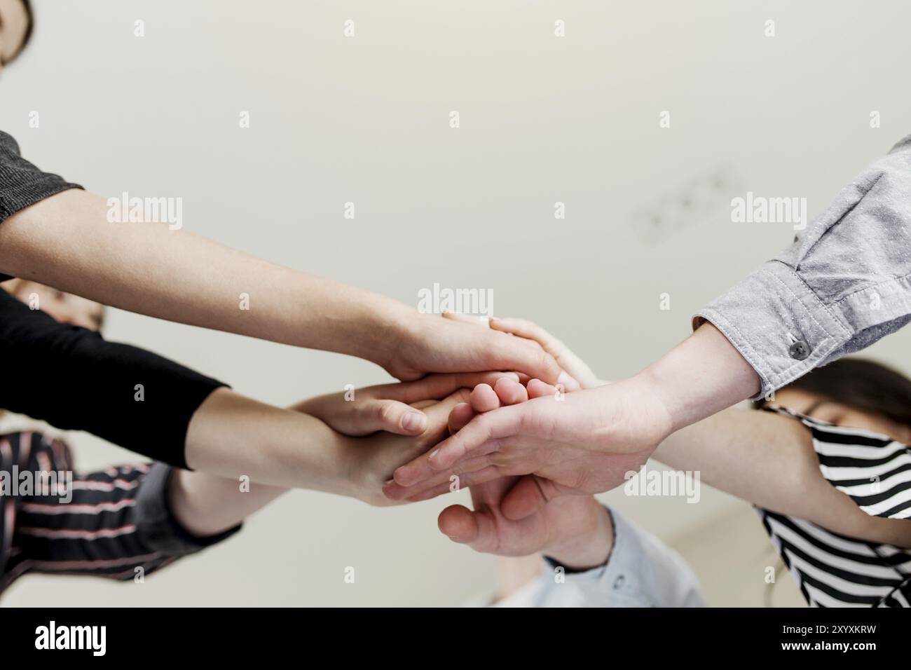 Group of people doing handshake and cross hands. Friendship, agreement ...