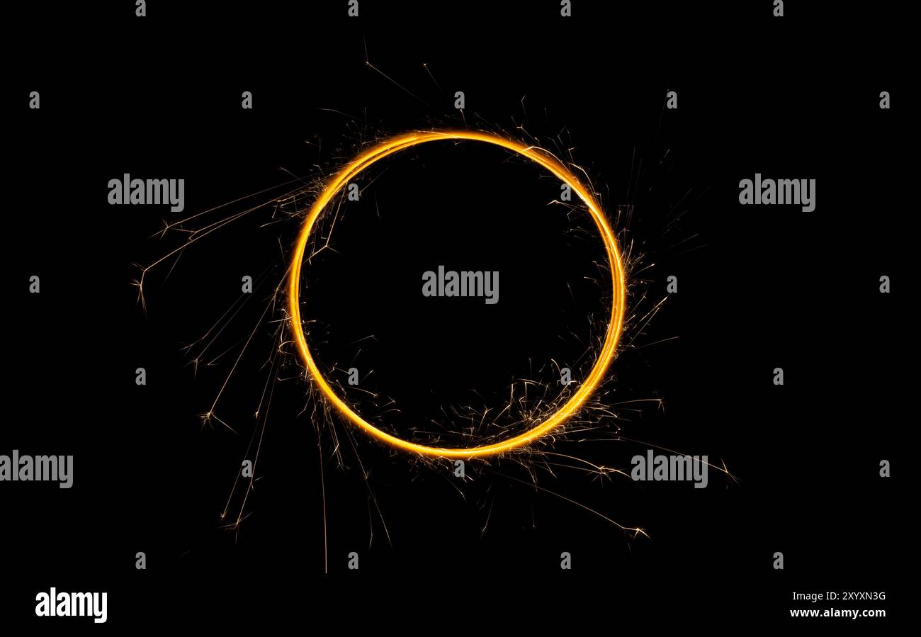 Circular lights with sparks on a black background Stock Photo - Alamy