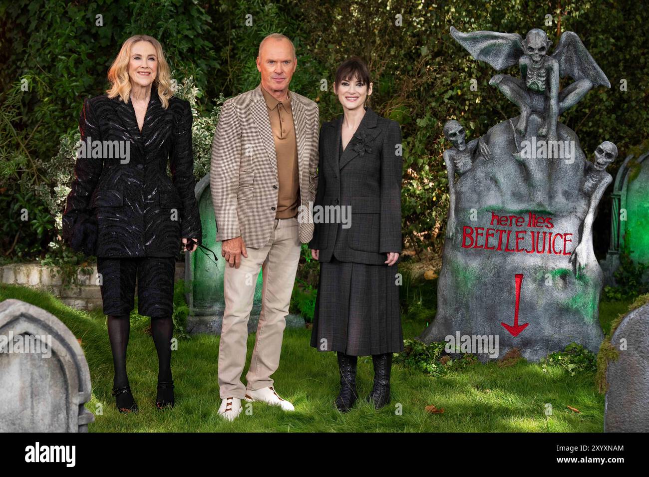 Catherine O'Hara, from left, Michael Keaton and Winona Ryder pose for ...