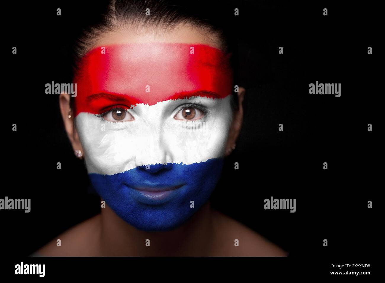 Portrait of a woman with the flag of the Netherlands painted on her ...