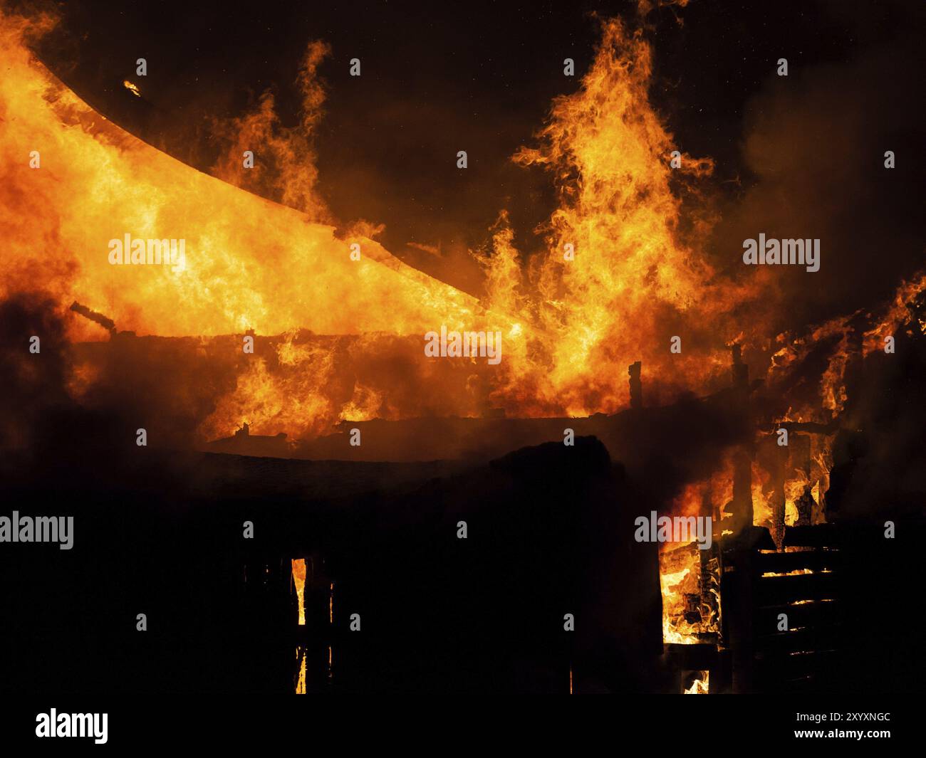 Arson or nature disaster, burning fire flame on wooden house roof Stock ...
