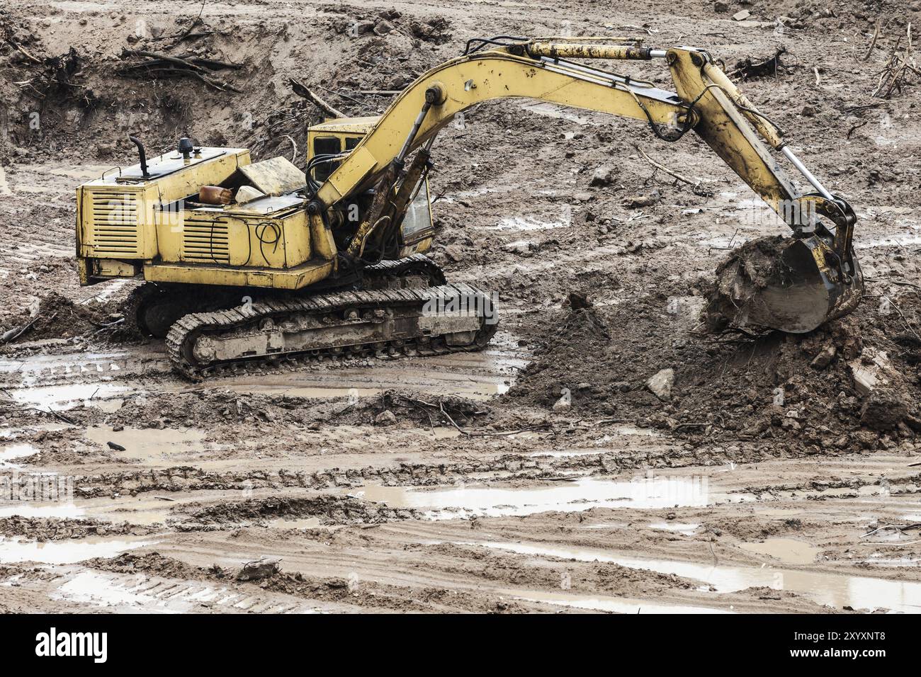 Old rusty earth digging excavator machine working at building ...