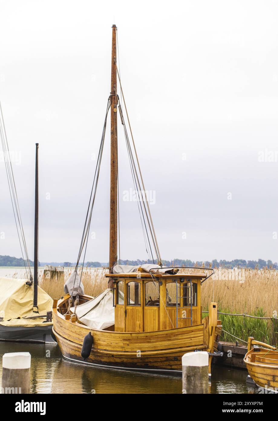 Vintage style boats in a small harbour Stock Photo - Alamy
