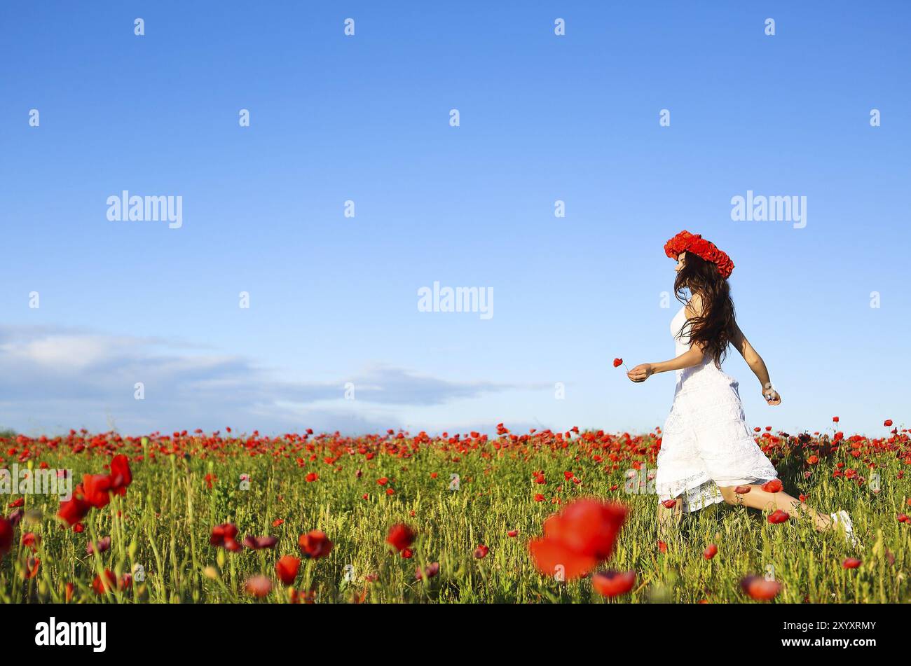 Woman running in field of flowers hi-res stock photography and images ...
